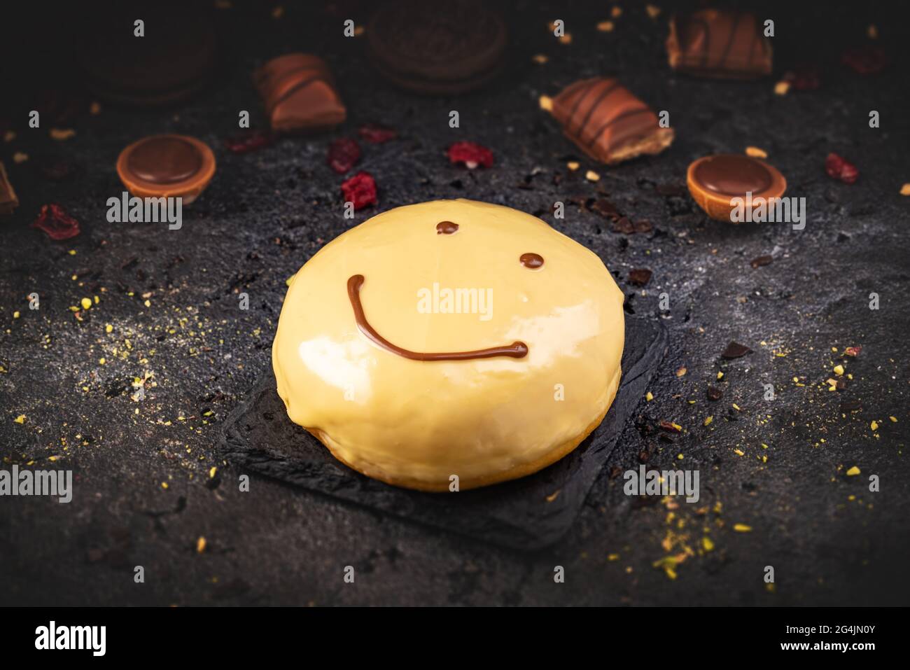 Tasty smile face doughnut or donut on black slate background Stock ...
