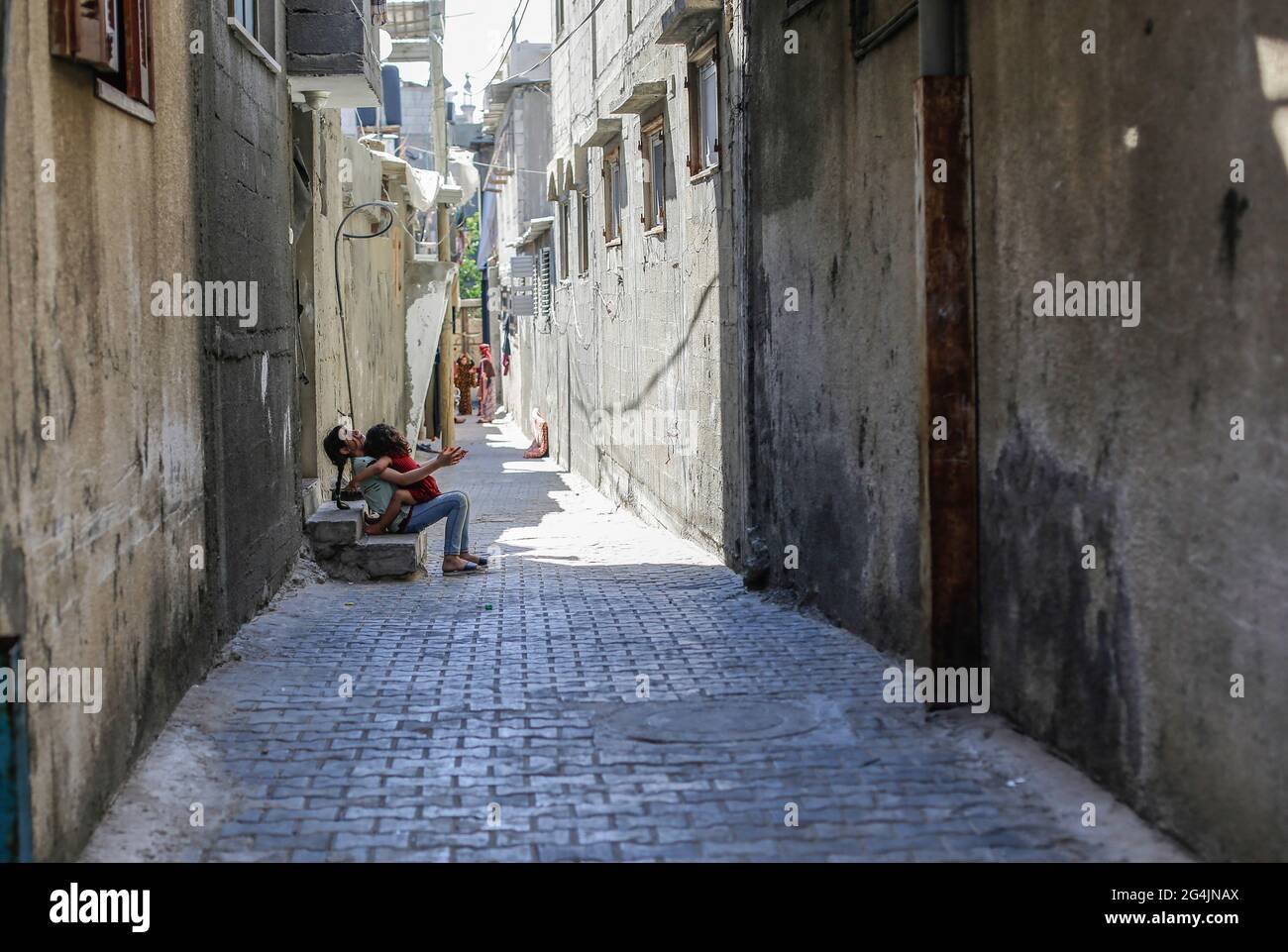 Palestinian children play on a street in Jabalia refugee camp, in the ...