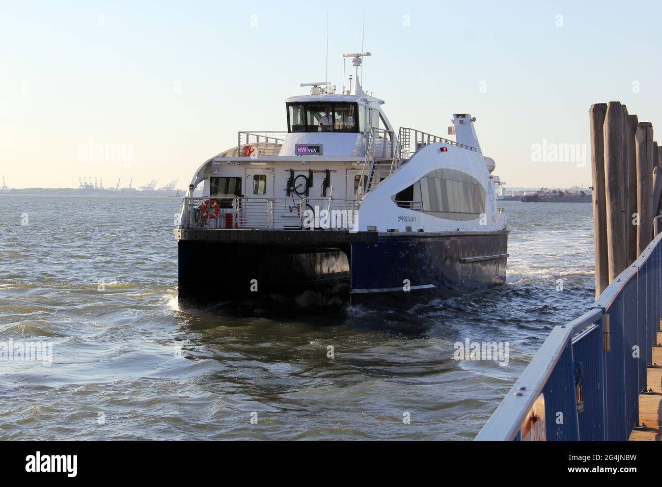 Commuter ferry boat OPPORTUNITY departing a pier at the Brooklyn Army ...