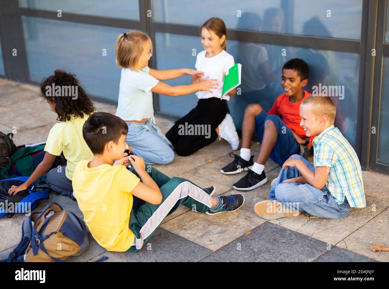 Group of children playing near school Stock Photo - Alamy