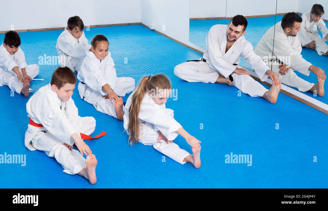 Children getting ready and stretching for karate Stock Photo - Alamy