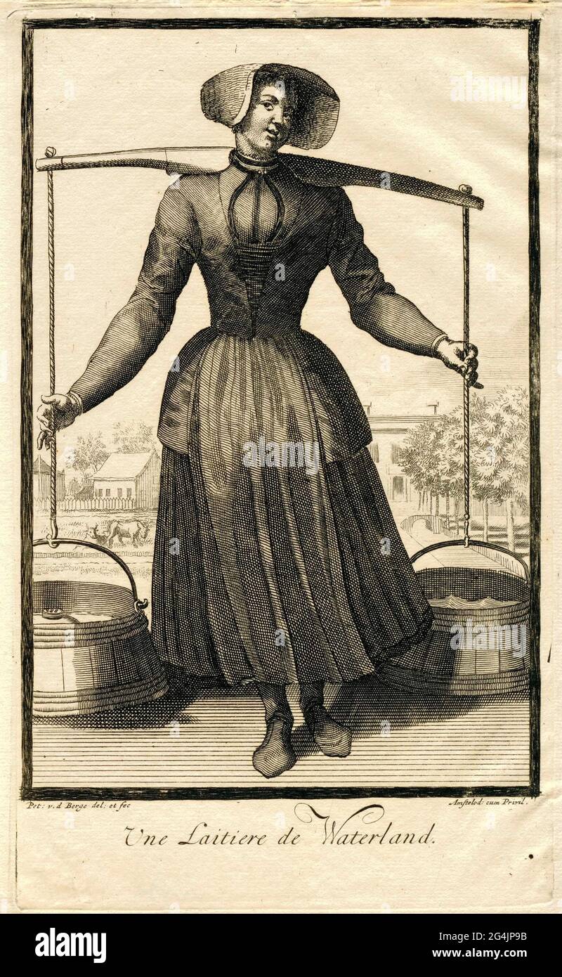 . A milk maid from Waterland carries a yoke with two buckets of milk ...
