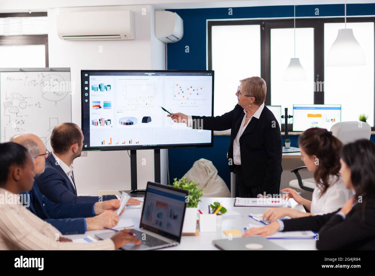 Senior woman company leader brainstorming in conference room Corporate ...