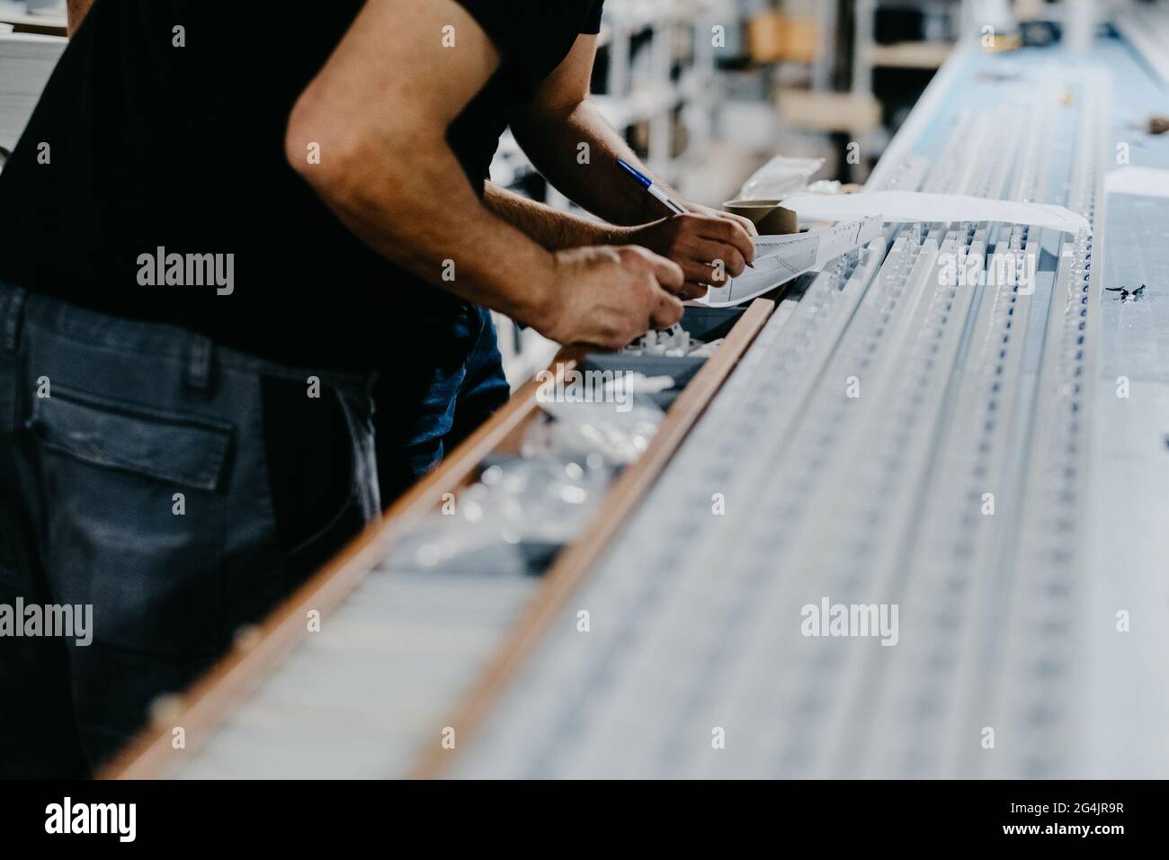 Person working with machine tools in a factory Stock Photo - Alamy