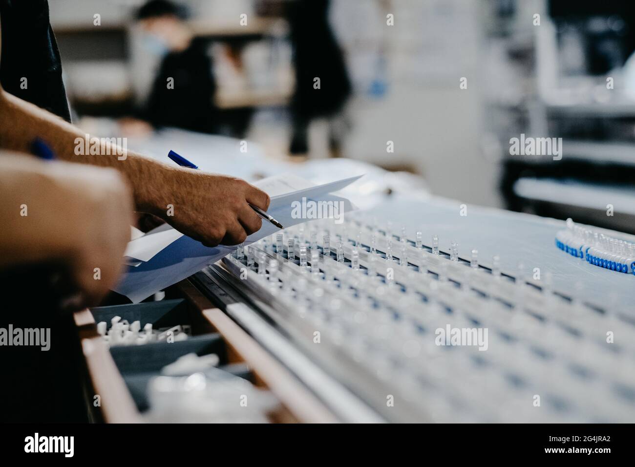 Person working with machine tools in a factory Stock Photo - Alamy