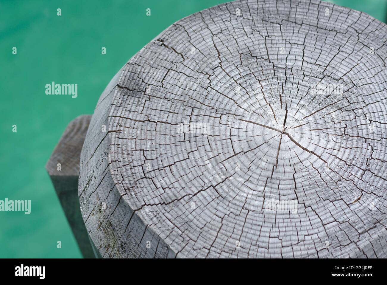 Top of a log post at the pier on a blurred background, horizontal ...