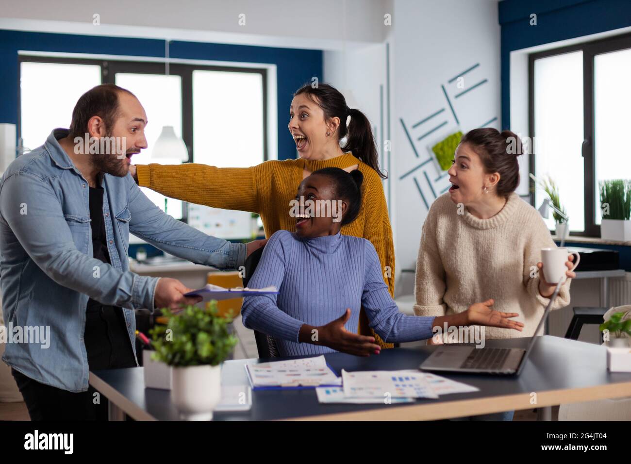 African manager businesswoman and diverse team celebrating victory ...