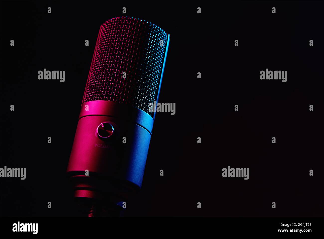 Studio microphone on dark background with copy space. Black ...