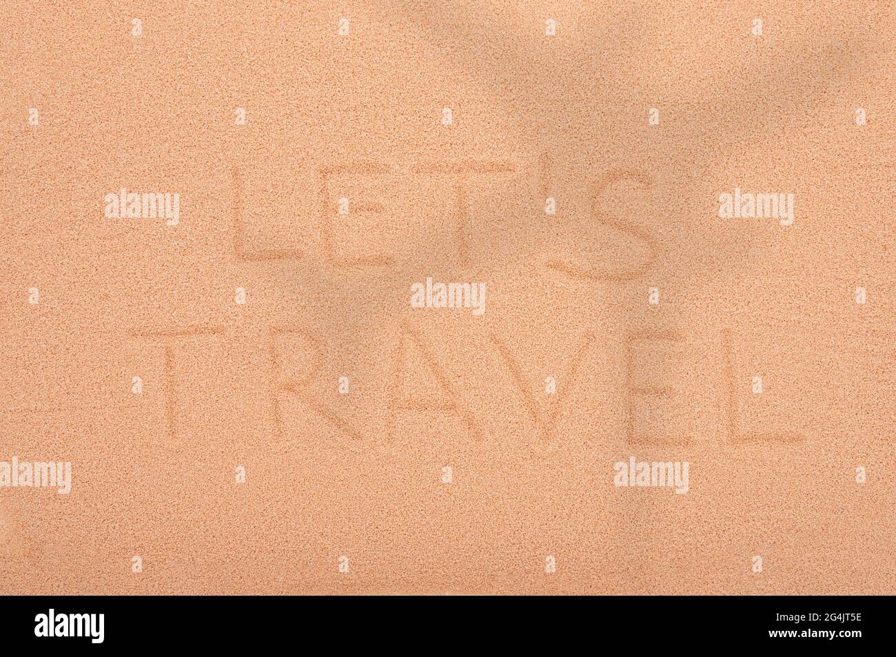 Flesh-colored background with a text saying ''LET'S TRAVEL" and a ...