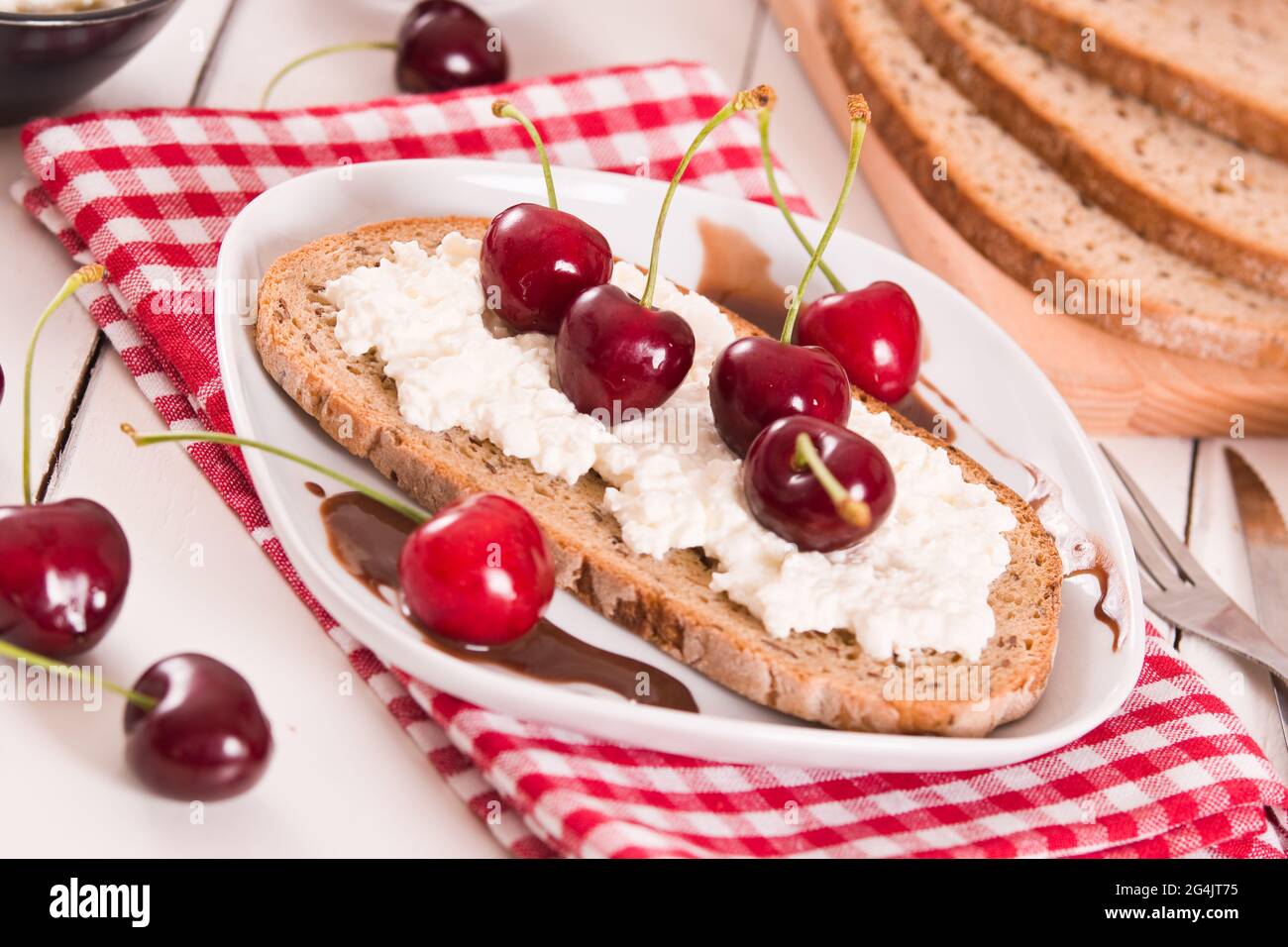 Rye bread with cottage cheese and cherries Stock Photo - Alamy