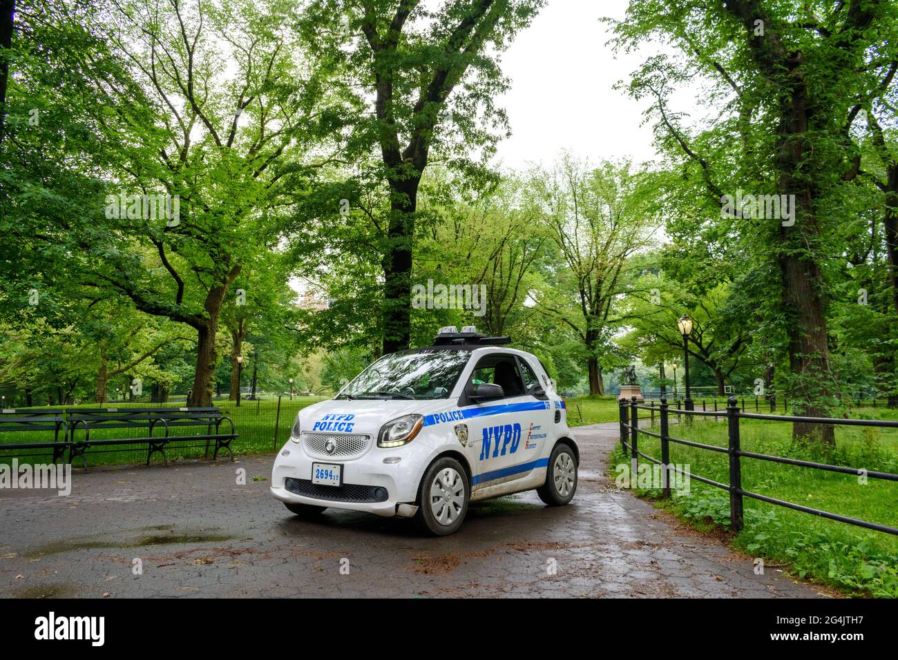 NYPD police Smart Fortwo small patrol car parked on green alley at ...