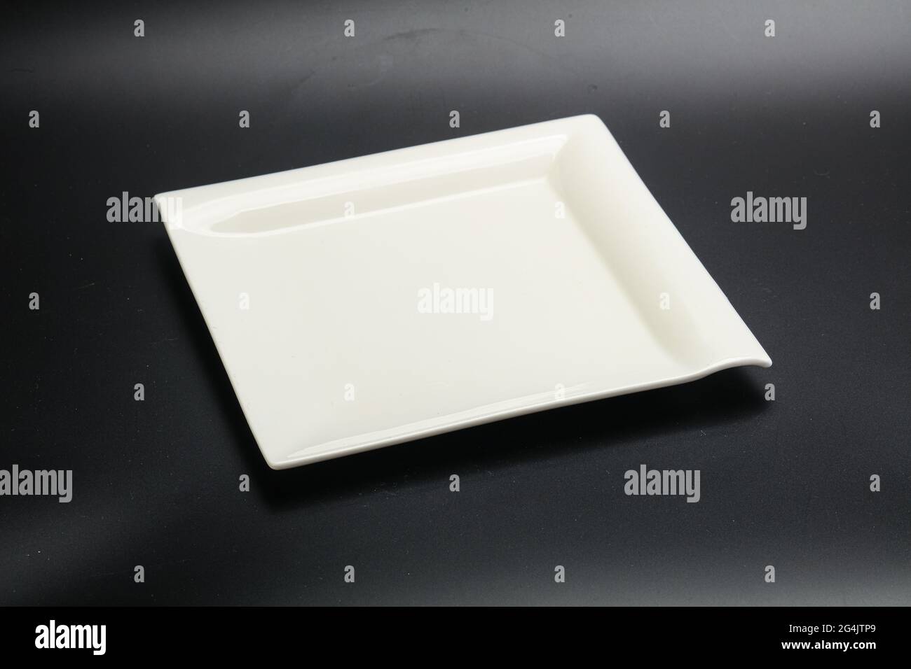 White empty plate for serving isolated Stock Photo - Alamy
