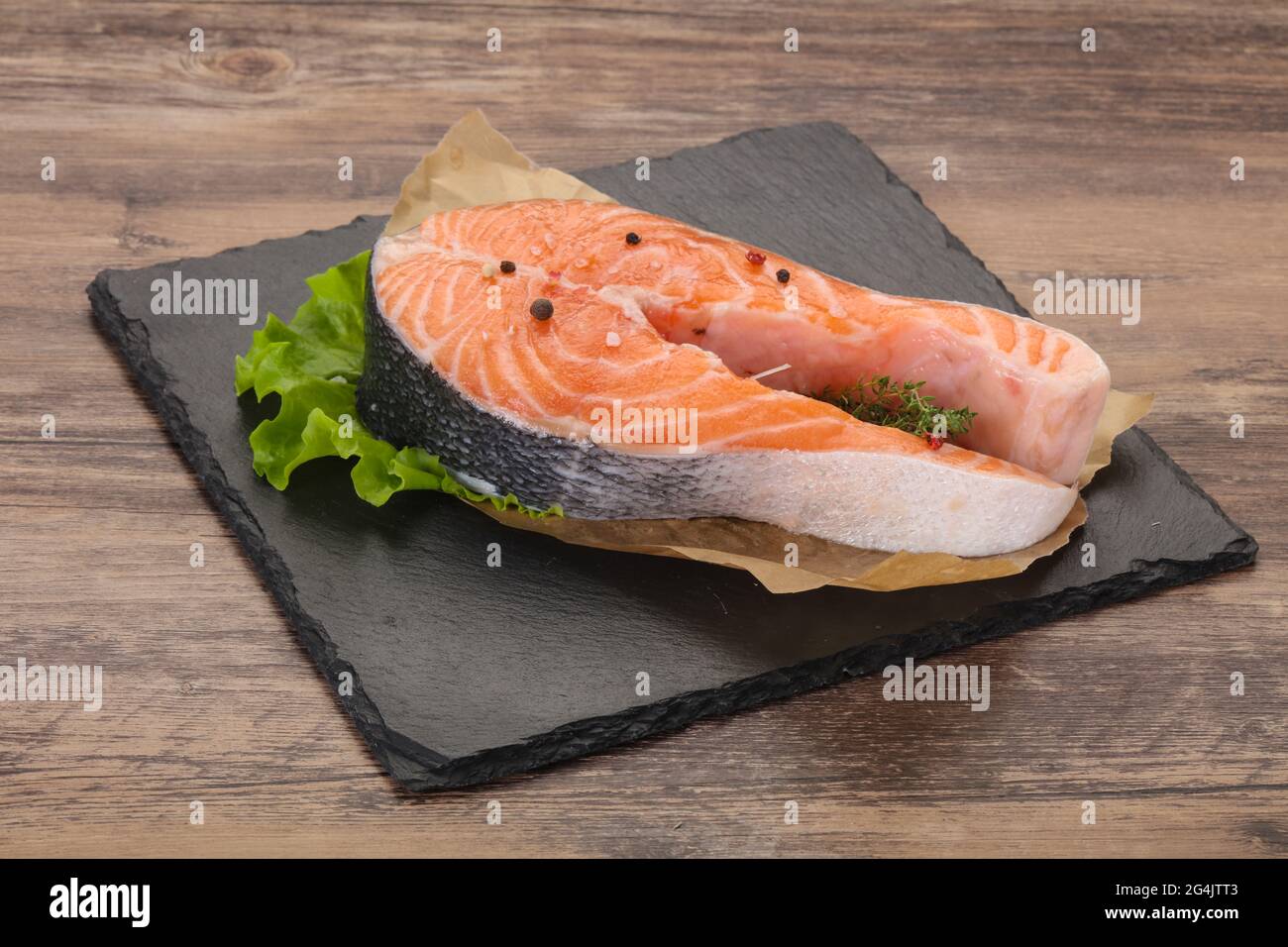 Raw salmon steak with salt and pepper - ready for grill Stock Photo - Alamy