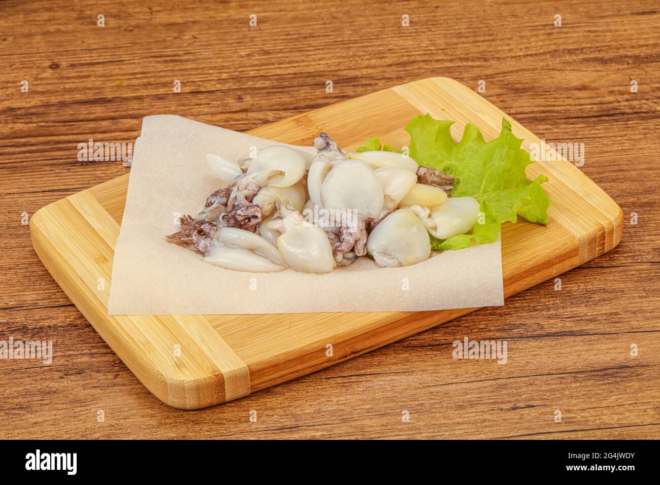 Raw seafood - cuttlefish for cooking over board Stock Photo - Alamy