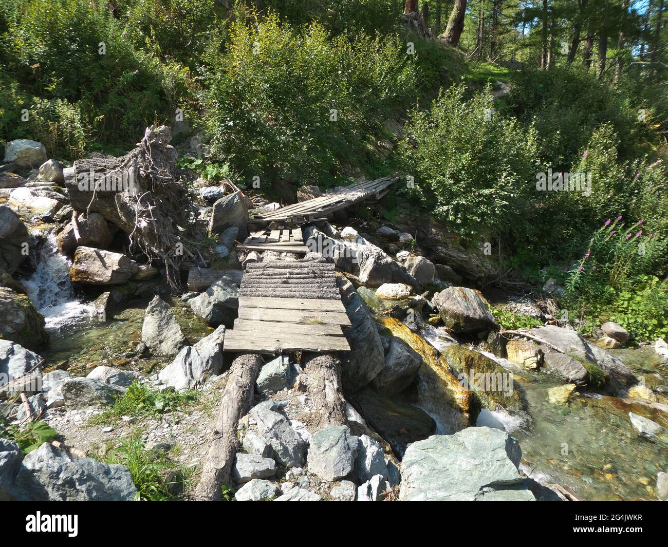 Wooden bridge over troubled water Stock Photo - Alamy