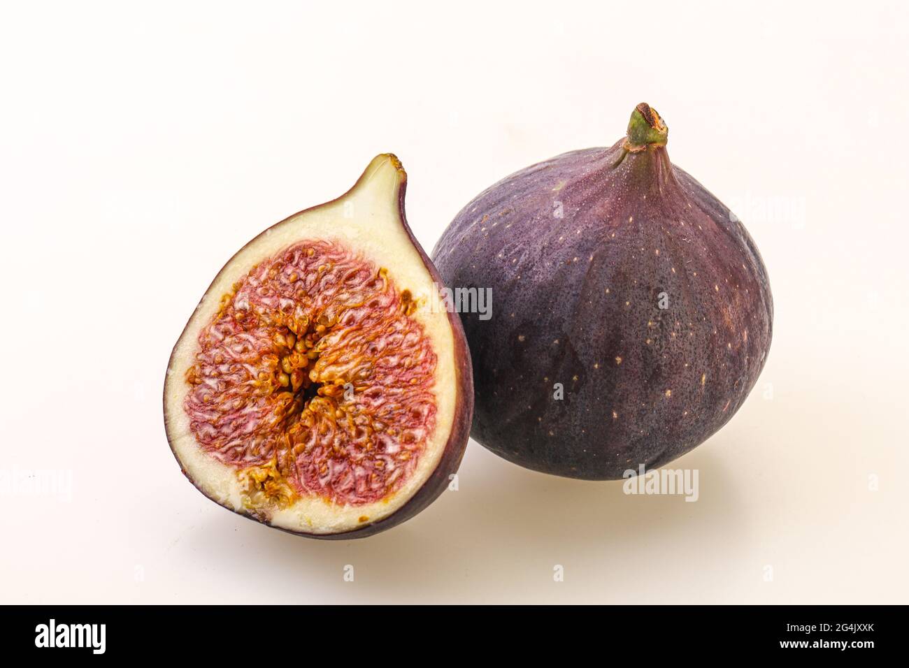 Sweet purple slice of fig fruit Stock Photo - Alamy