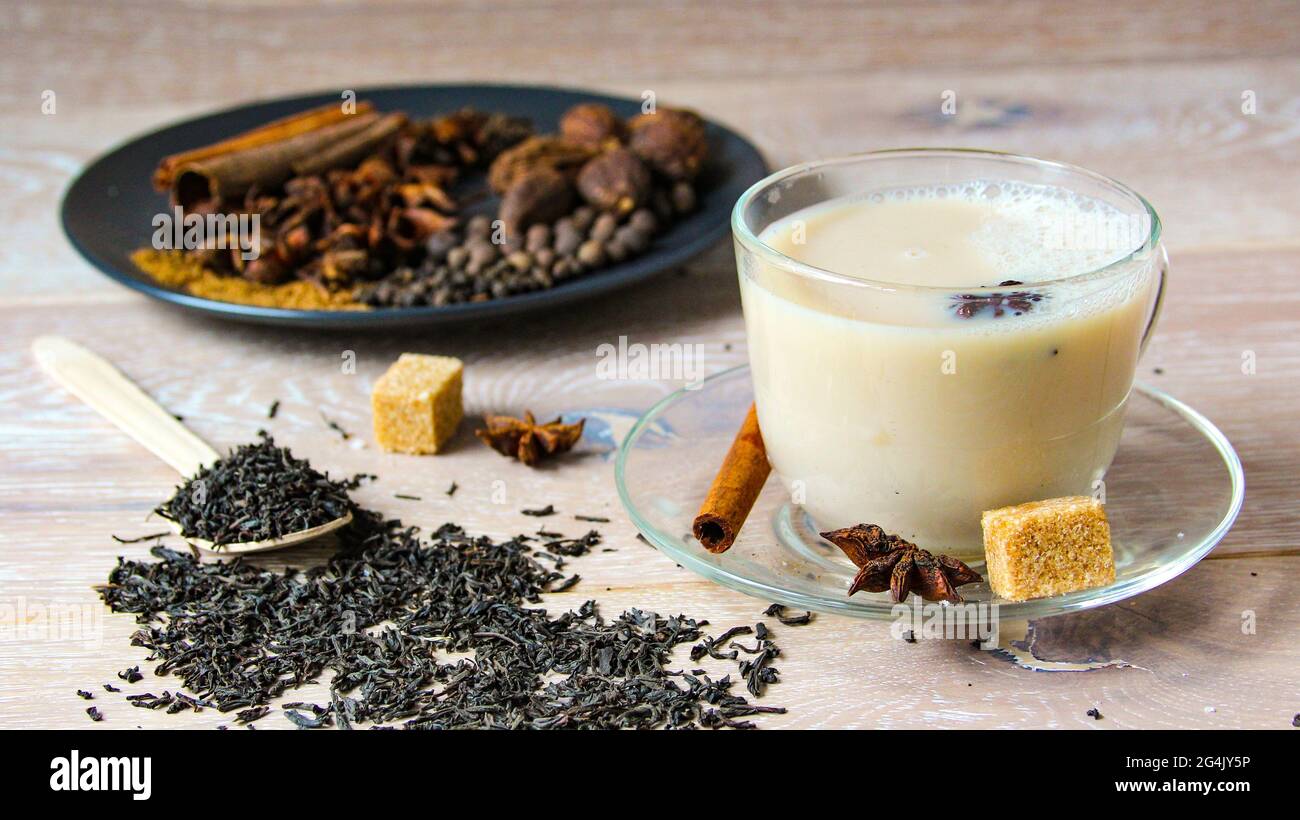Traditional indian or Asian drink masala tea with spices and sugar in ...