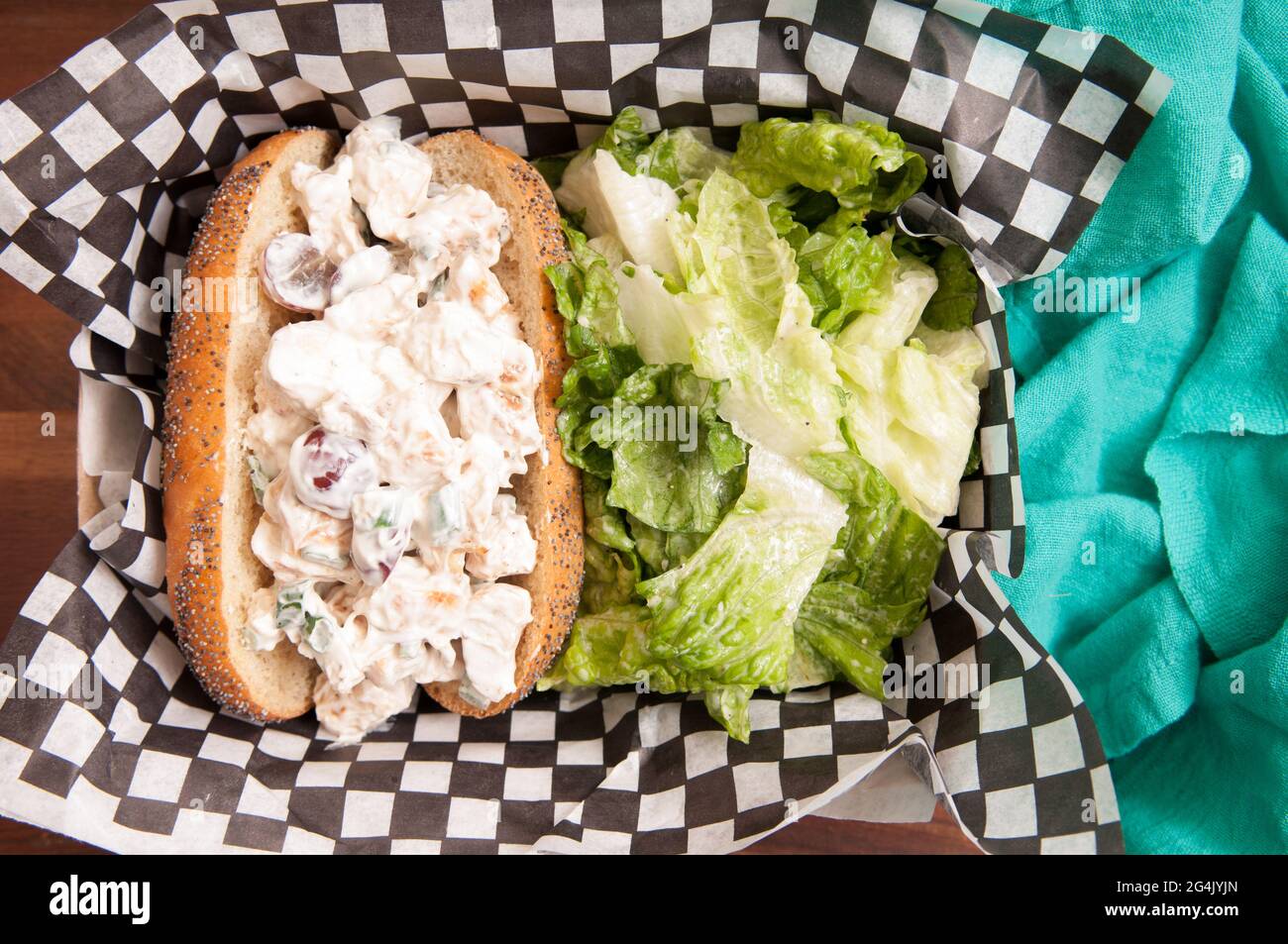 Top view shot of Waldorf styled chicken salad sandwich with grapes and ...