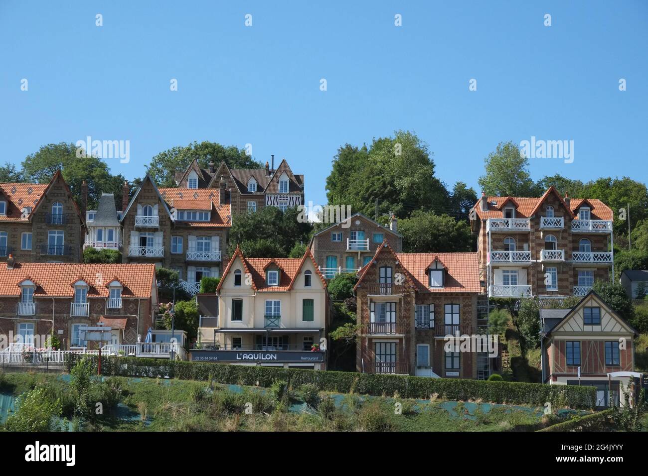 Pretty french houses clustered on the hillside hi-res stock photography ...