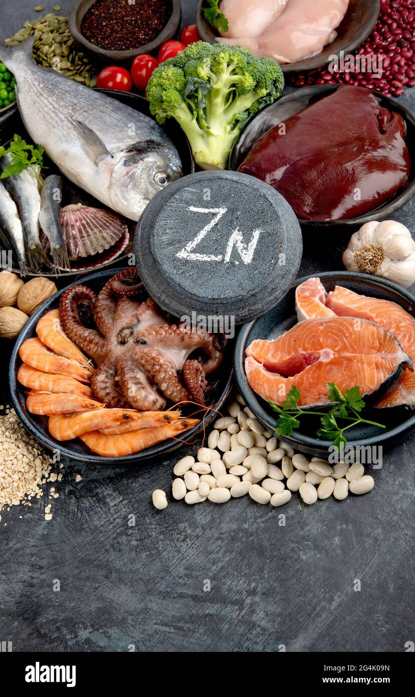 Food high in zinc on dark background. Healthy eating concept Stock ...