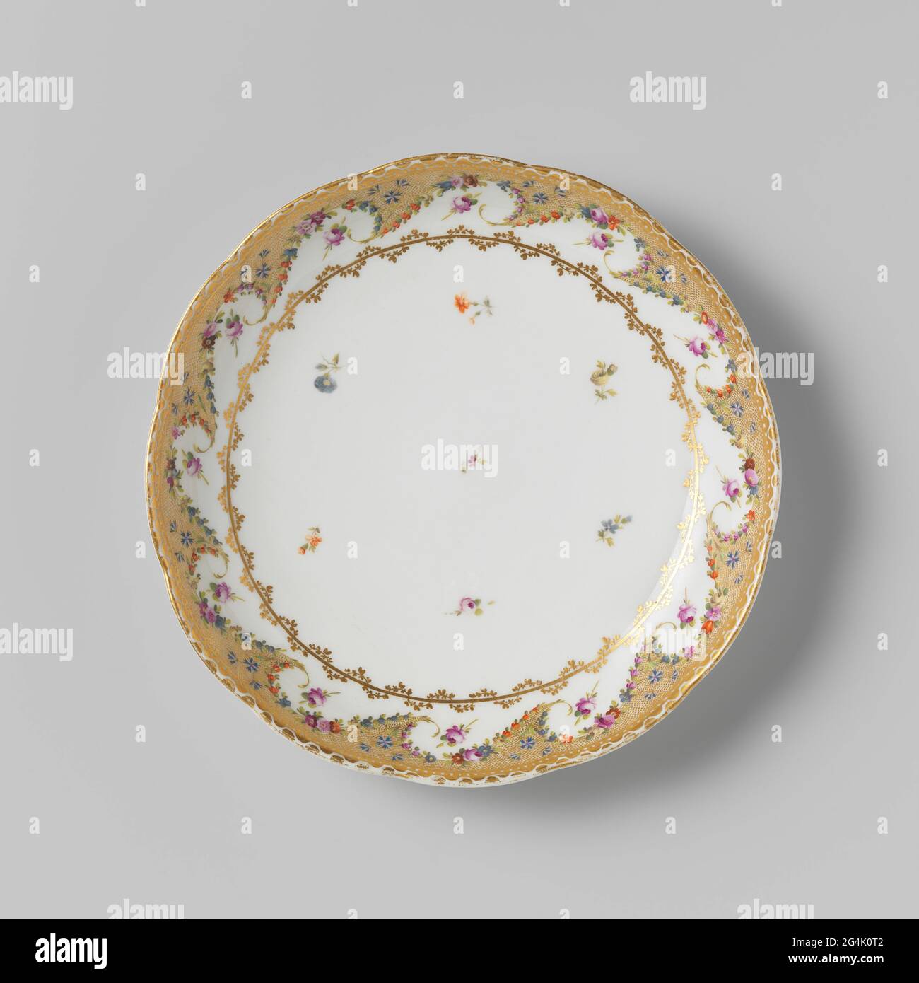 Dish. Deep, round dish with scalloped edge of porcelain. Painted with a ...