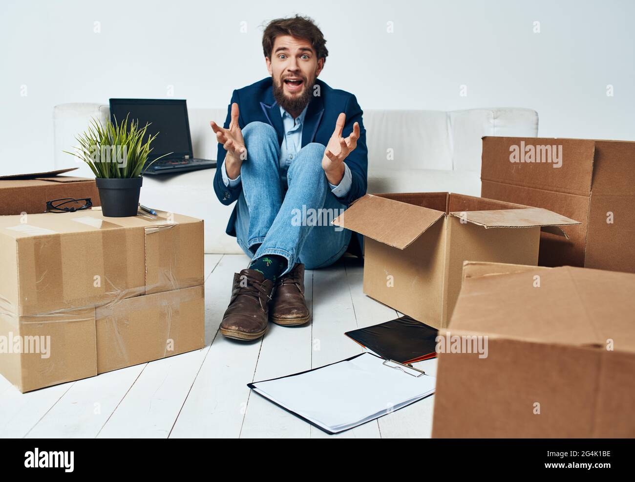 business man in the office packing things dismissal moving Stock Photo ...