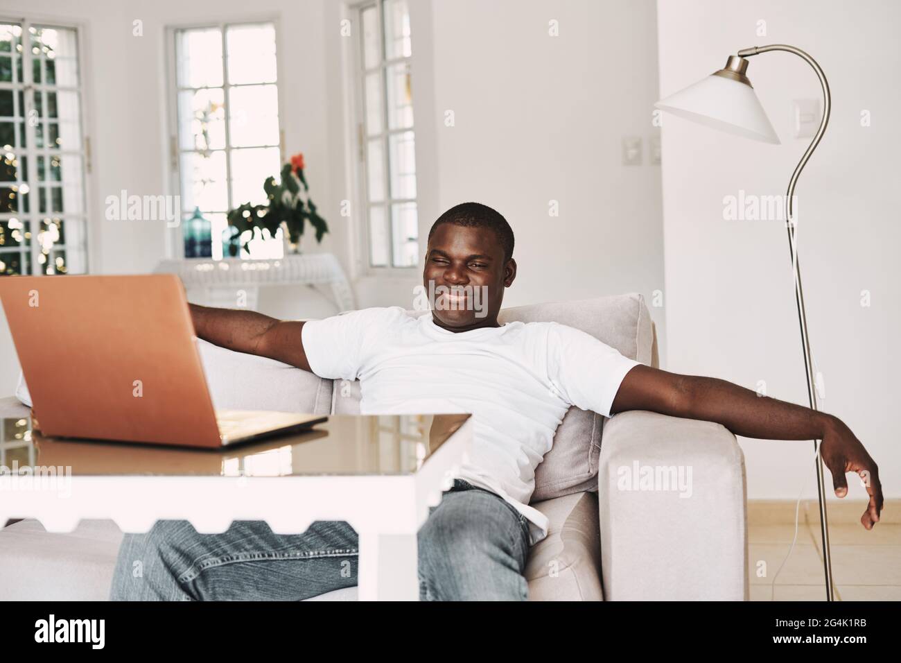 man of african appearance at home in front of laptop rest Stock Photo ...