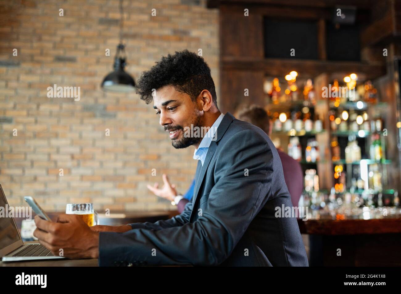 Young business man having a break in a restaurant. Work occupation ...