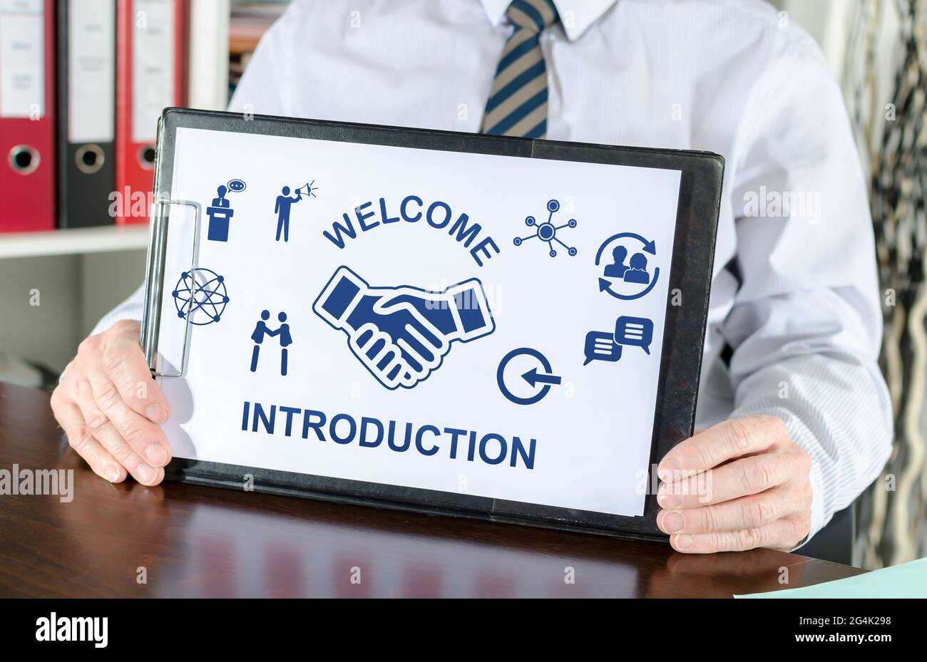 Introduction concept shown by a businessman Stock Photo - Alamy
