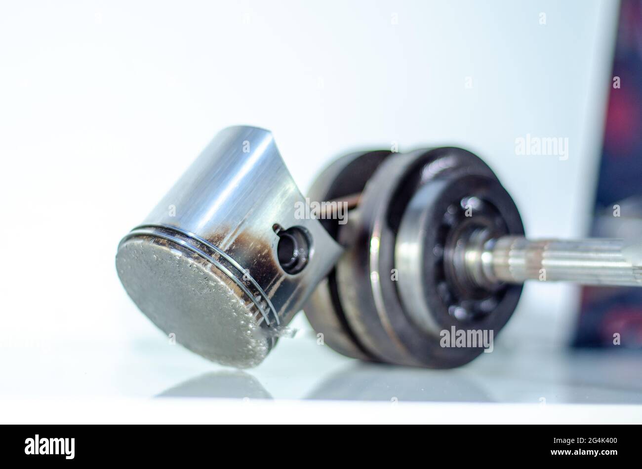 Crankshaft bearing overheating and piston isolated on a white ...