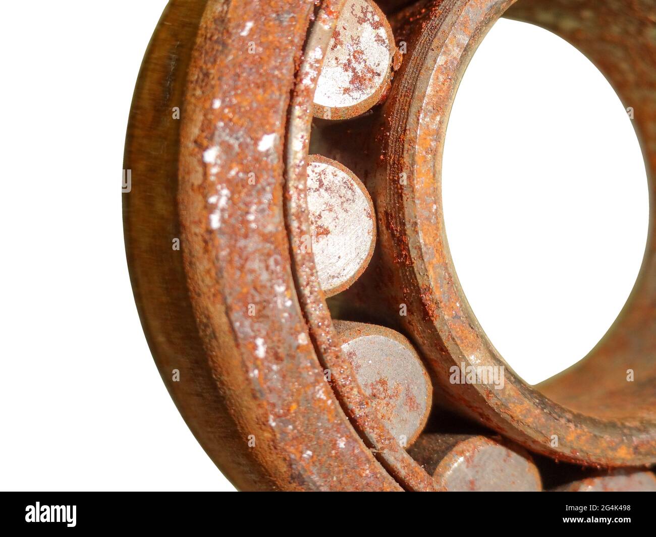 Closeup shot of a stuck rusty ball bearing isolated on a white ...