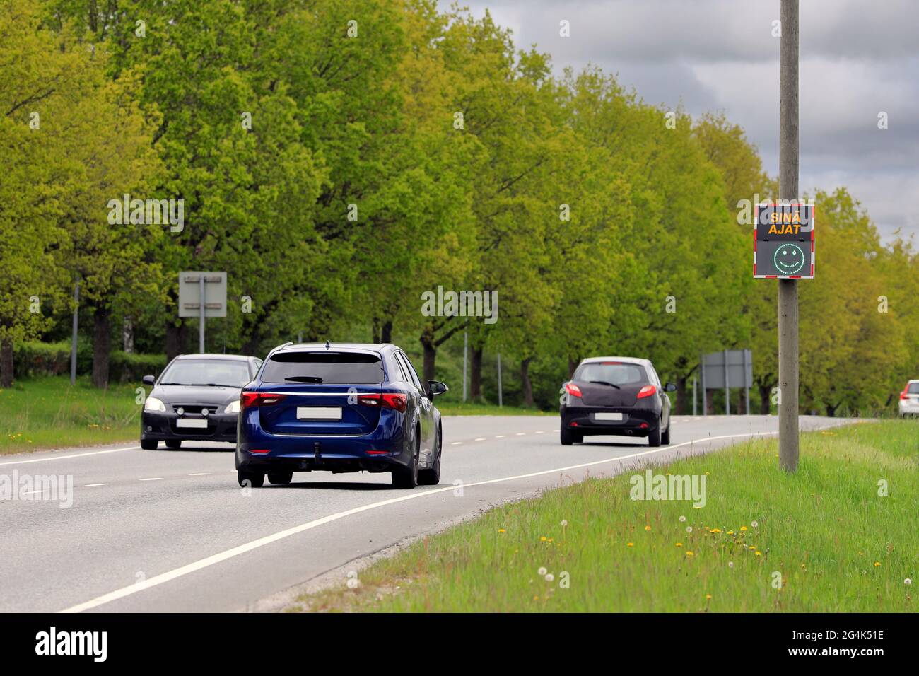 Speed monitoring device showing a happy green smiley face to driver ...