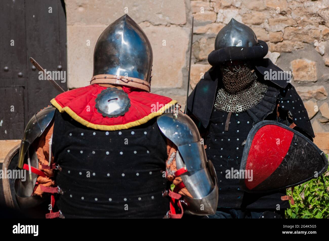 Battle of two medieval warriors fighting with swords and shields in the ...