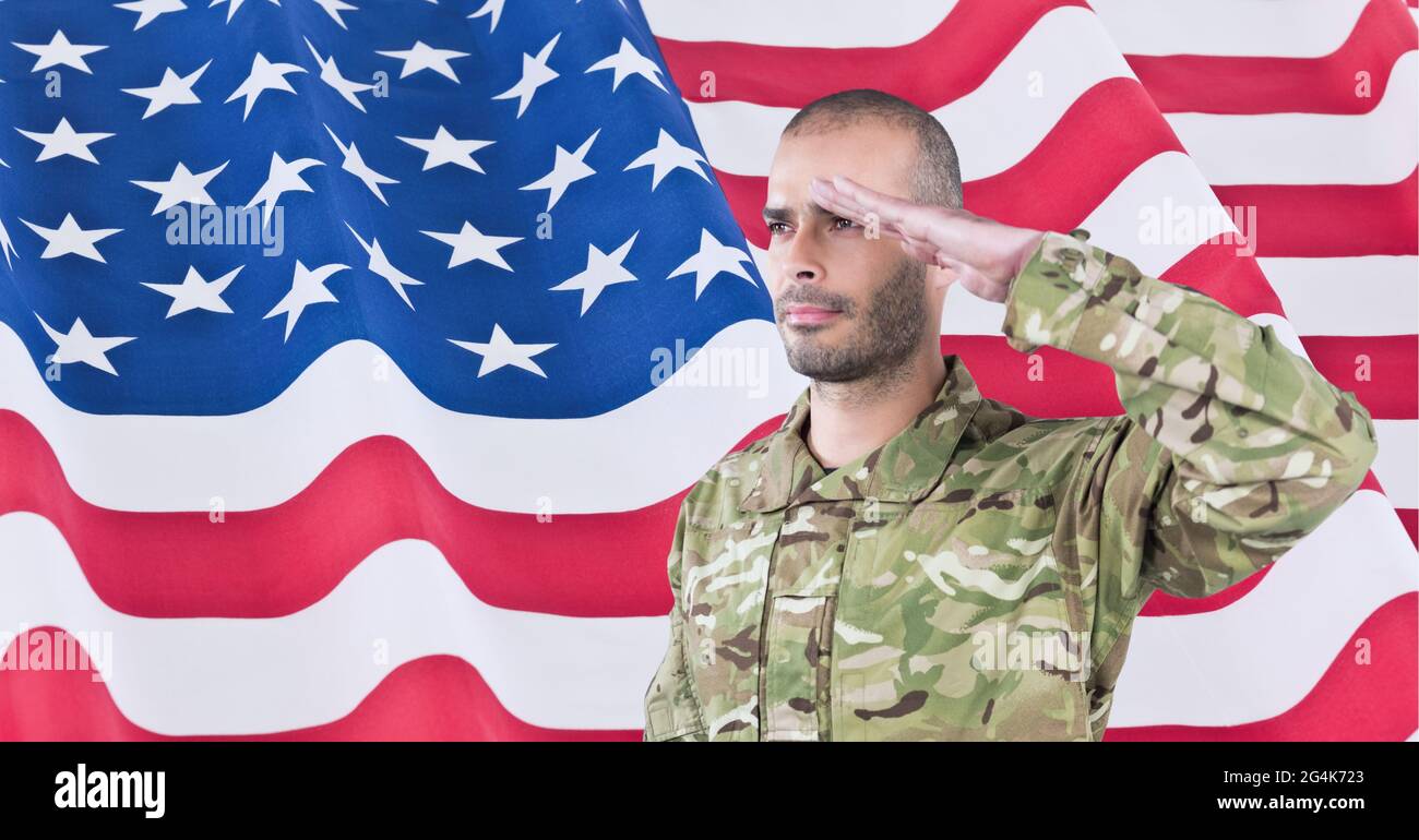 Composition of male soldier saluting over american flag Stock Photo - Alamy