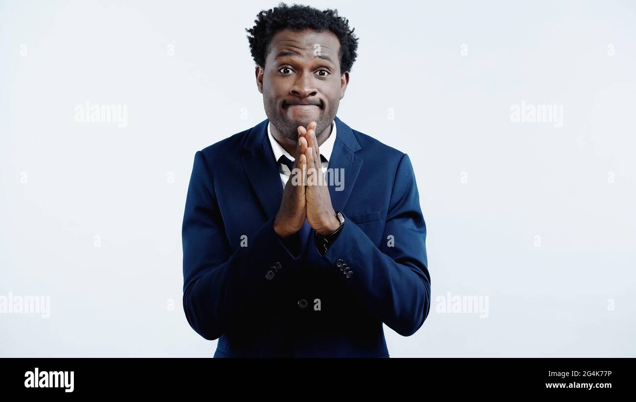 Black Man In Suit Praying