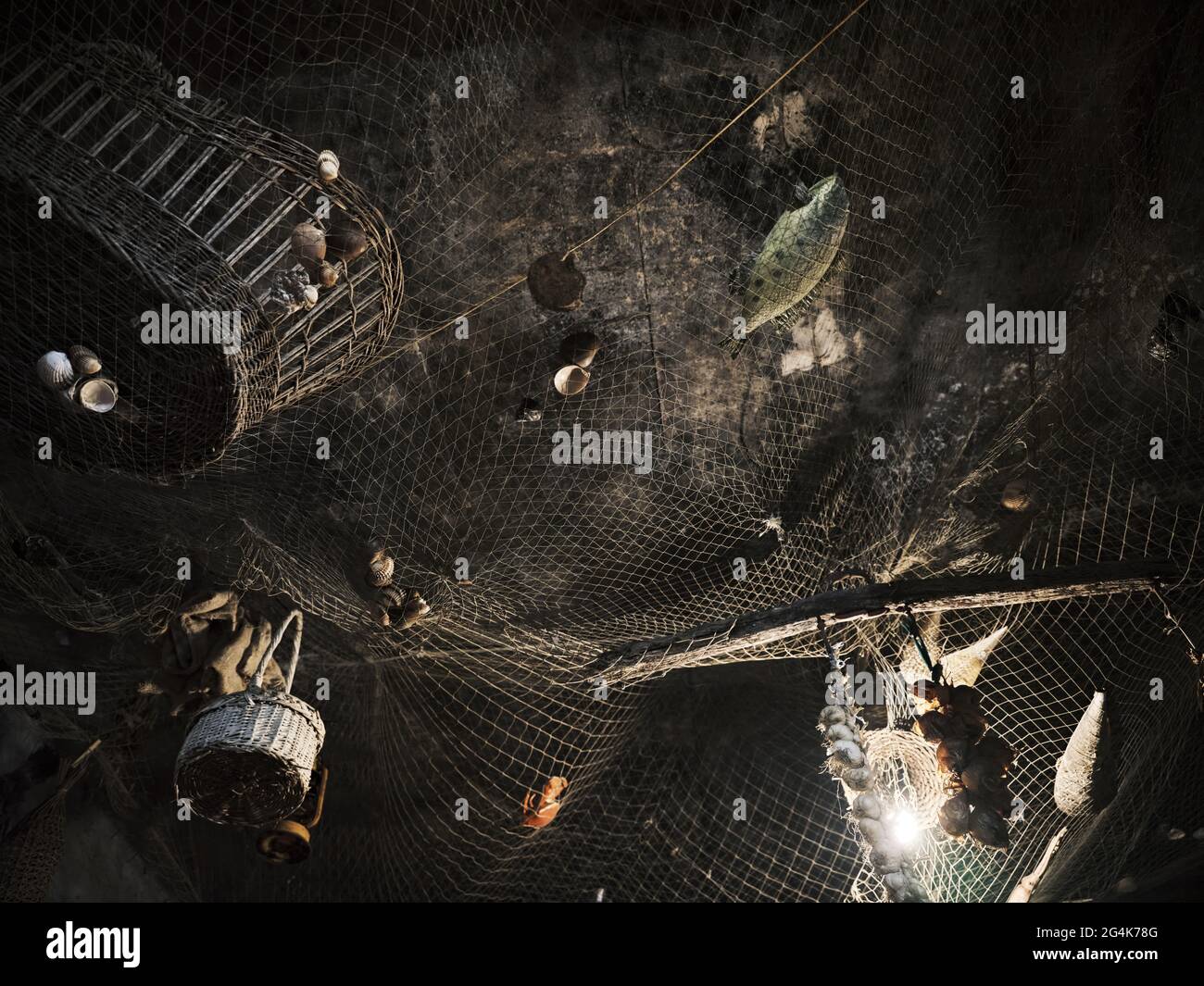 Low angle shot of the inside of an old dark storage room with stuff ...