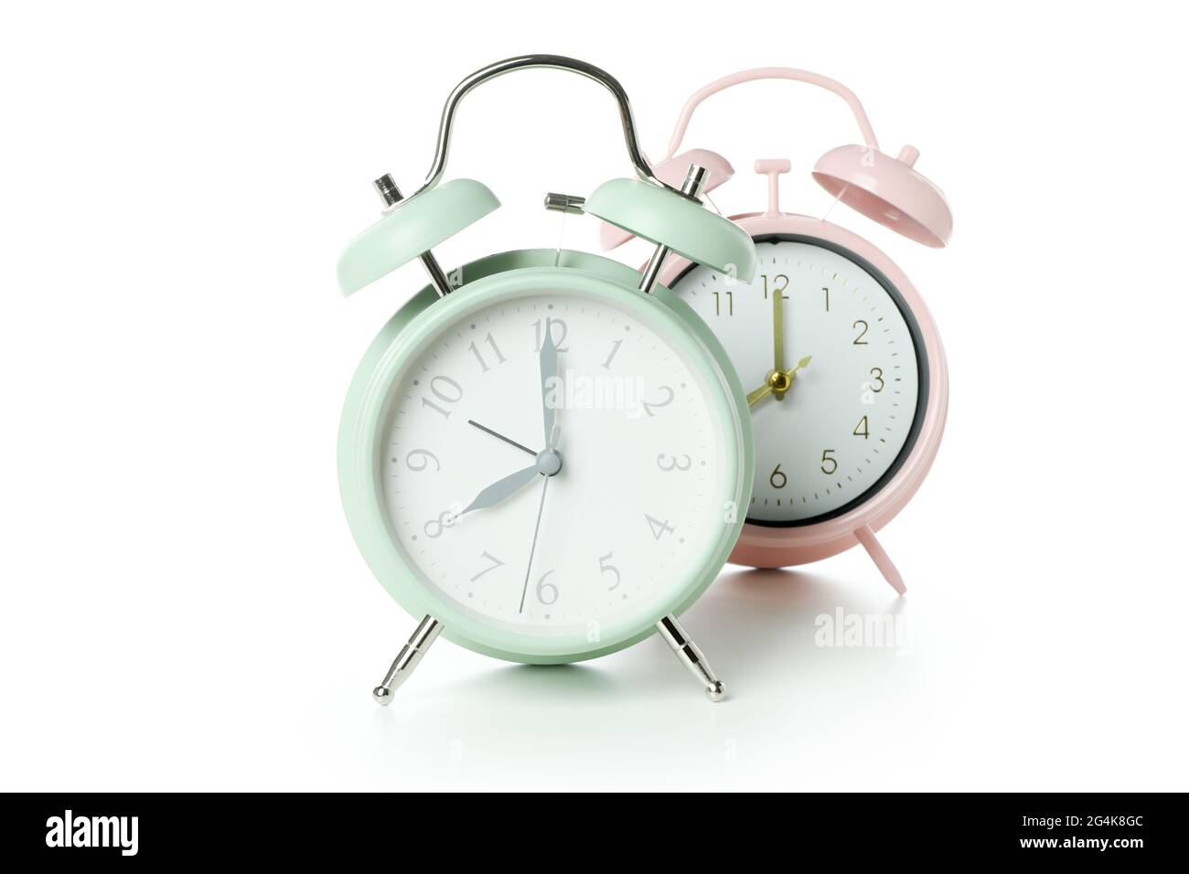 Two alarm clocks isolated on white background Stock Photo - Alamy
