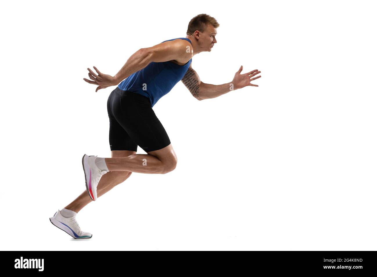 Caucasian professional male athlete, runner training isolated on white ...