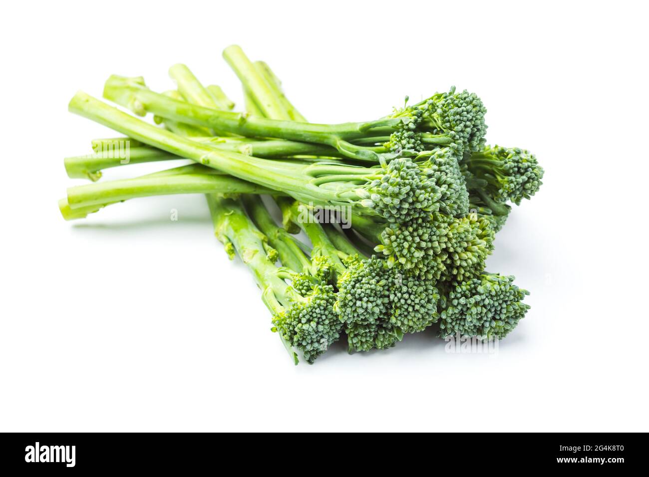 Raw broccolini heap isolated on white background Stock Photo - Alamy
