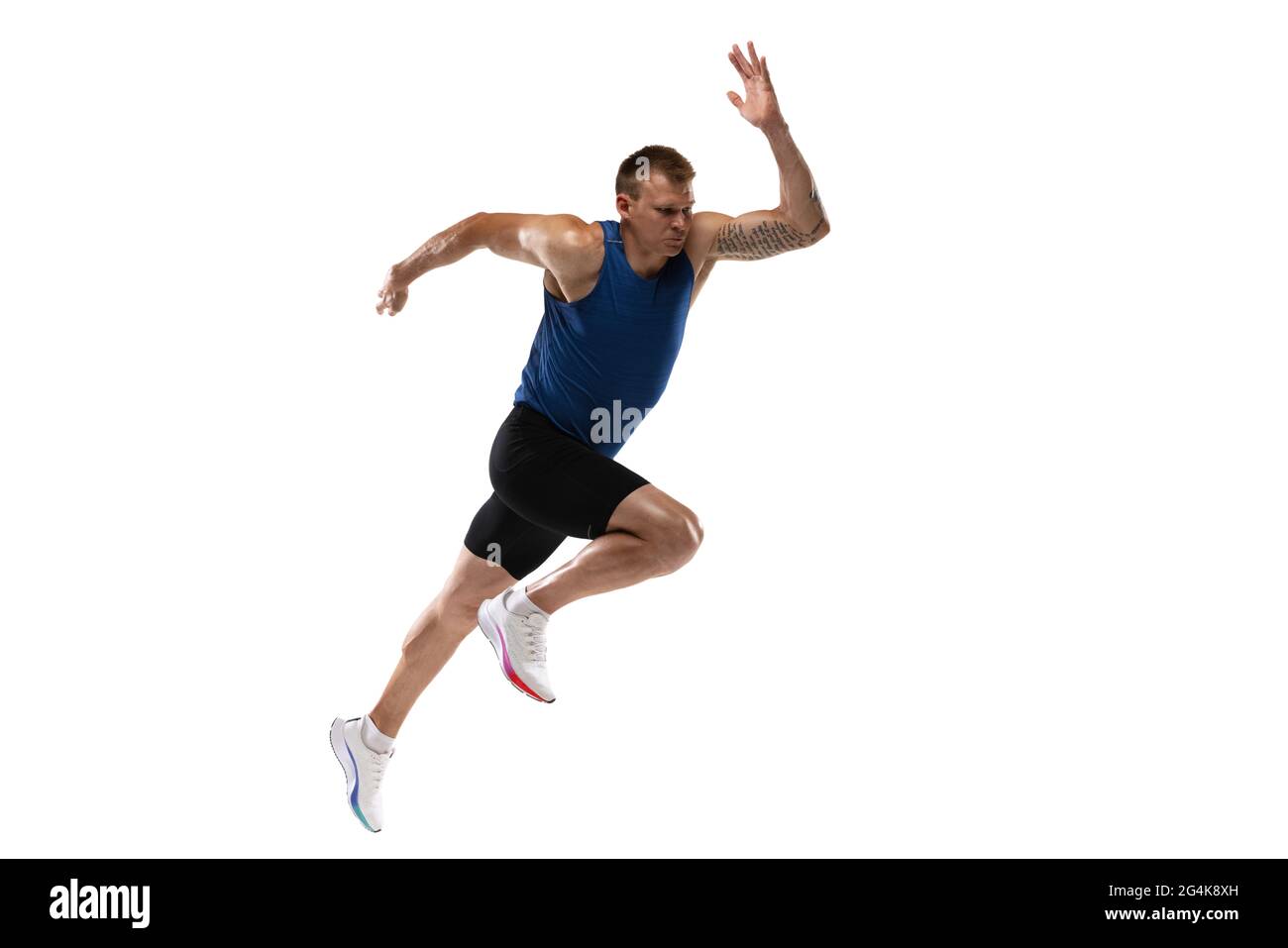 Caucasian professional male athlete, runner training isolated on white ...