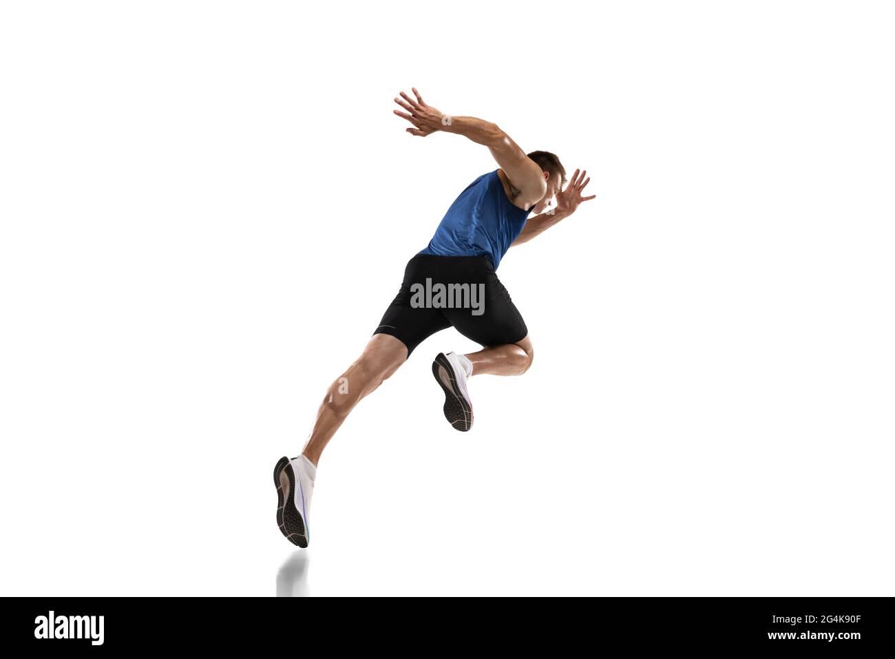 Caucasian professional male athlete, runner training isolated on white ...
