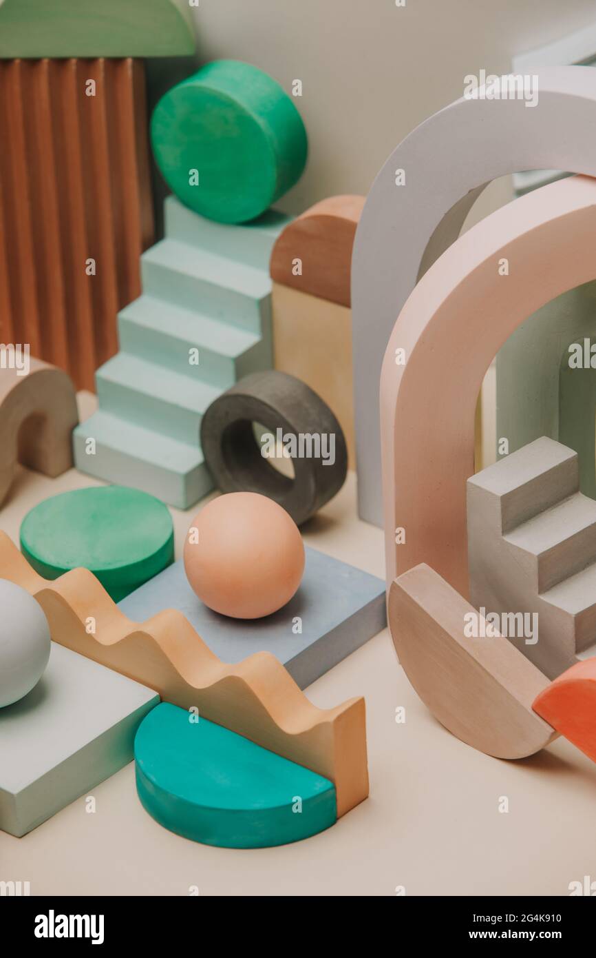 Assortment of wooden geometric figures in pastel colours Stock Photo ...