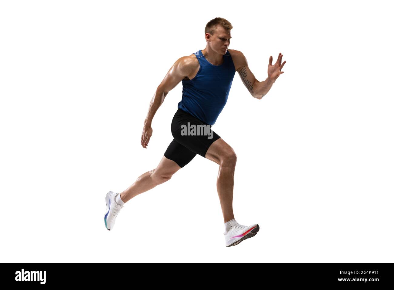 Caucasian professional male athlete, runner training isolated on white ...
