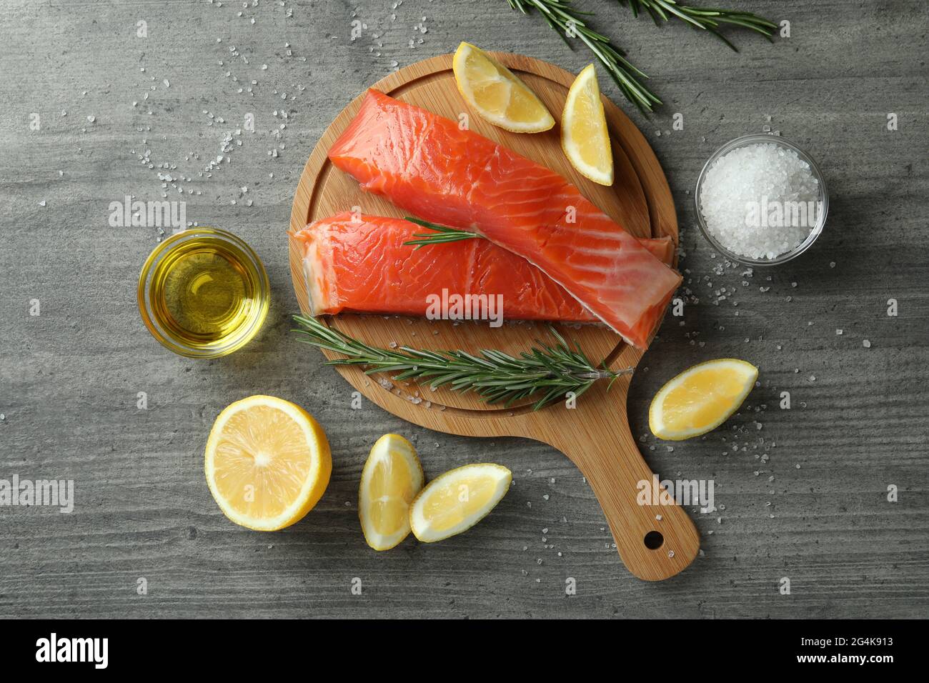 Concept of cooking salmon on gray textured table Stock Photo - Alamy
