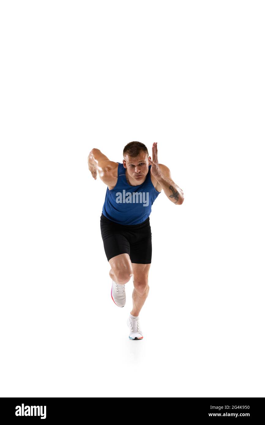 Caucasian professional male athlete, runner training isolated on white ...