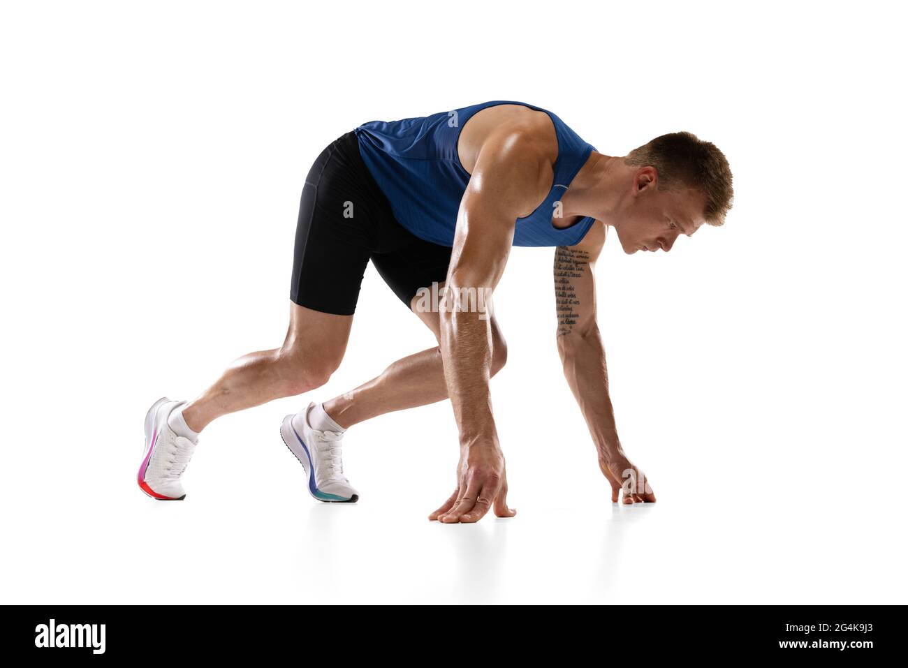 Caucasian professional male athlete, runner training isolated on white ...