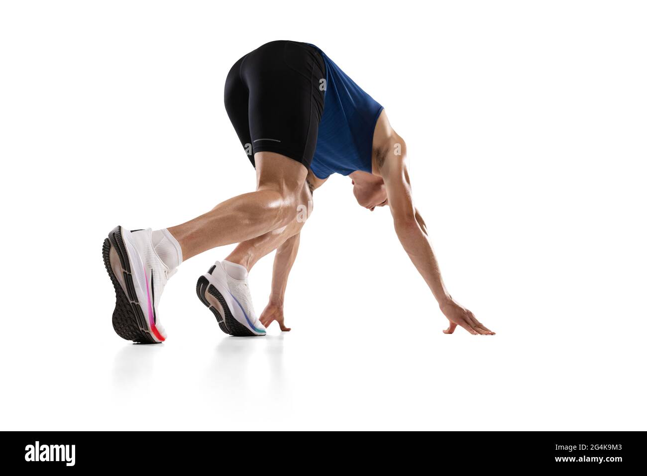Caucasian professional male athlete, runner training isolated on white ...
