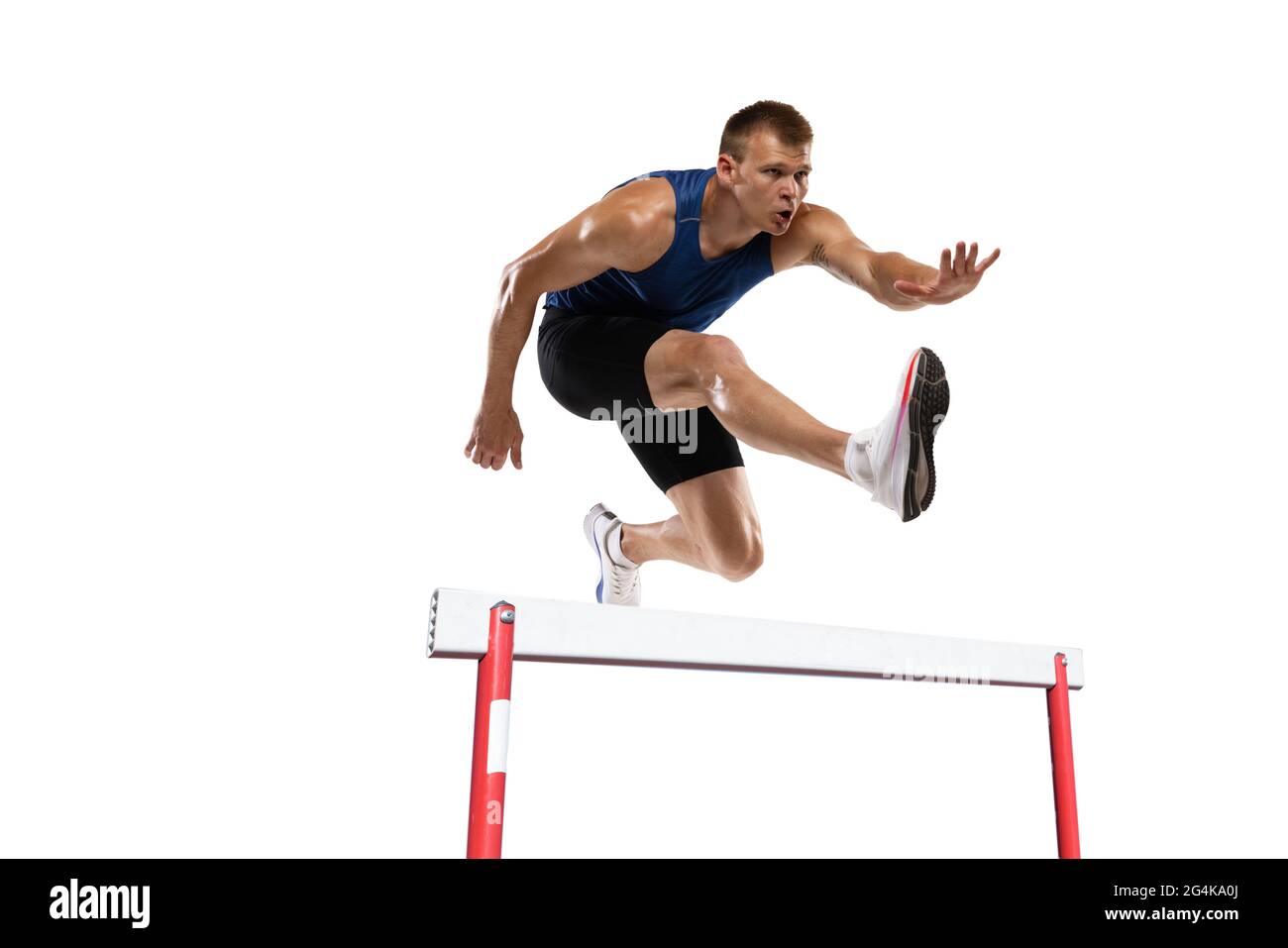 Athlete man athlete jumps over the barrier isolated on white background ...