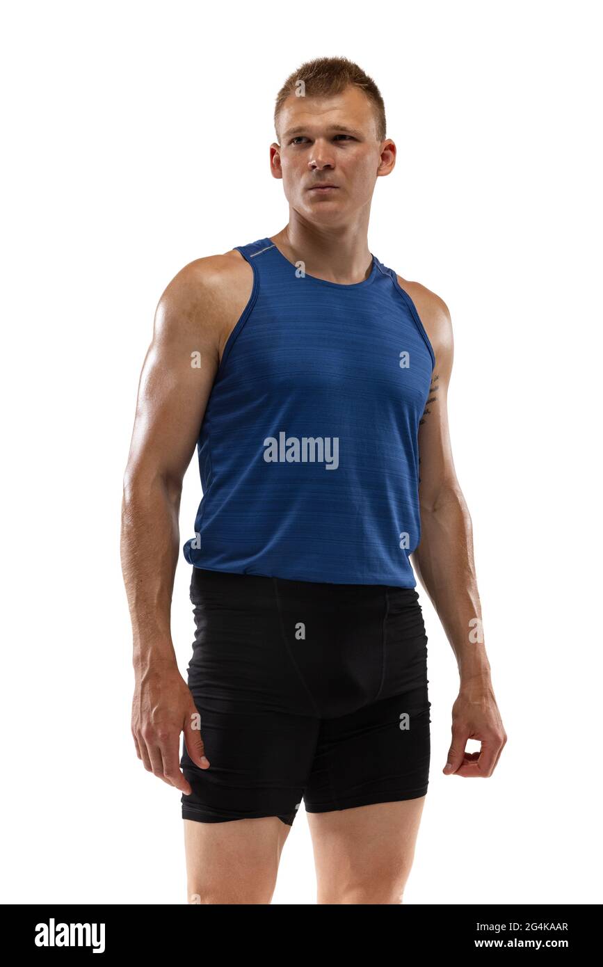 Caucasian professional male athlete, runner standing isolated on white ...