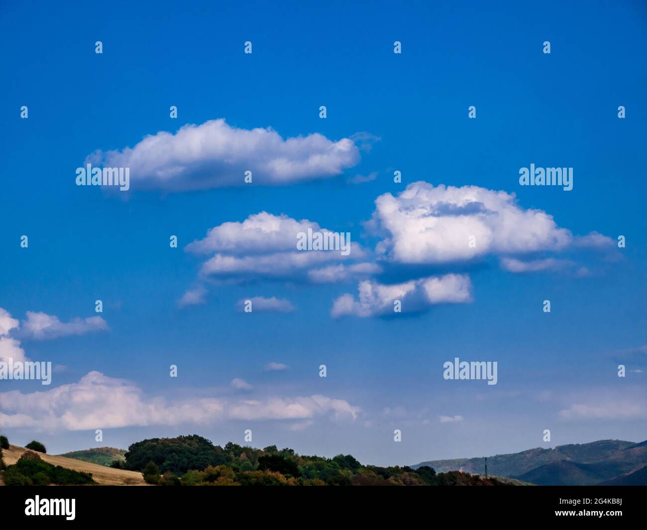 Beautiful clouds over a landscape Stock Photo - Alamy